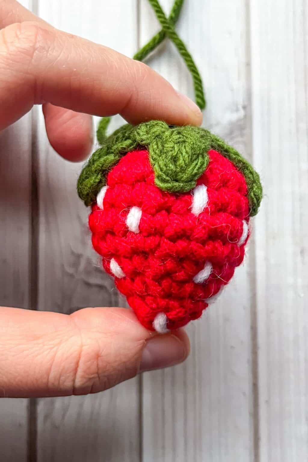 Crochet Strawberry Keychain Pattern - thecaffeinatedsnail.com